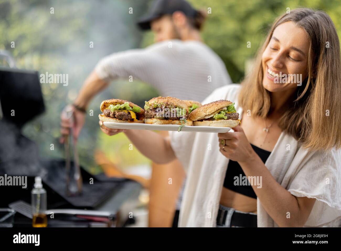 Young friends cooking together hi-res stock photography and images - Alamy