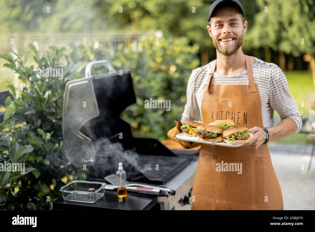 Man making barbeque meat food hi-res stock photography and images - Alamy