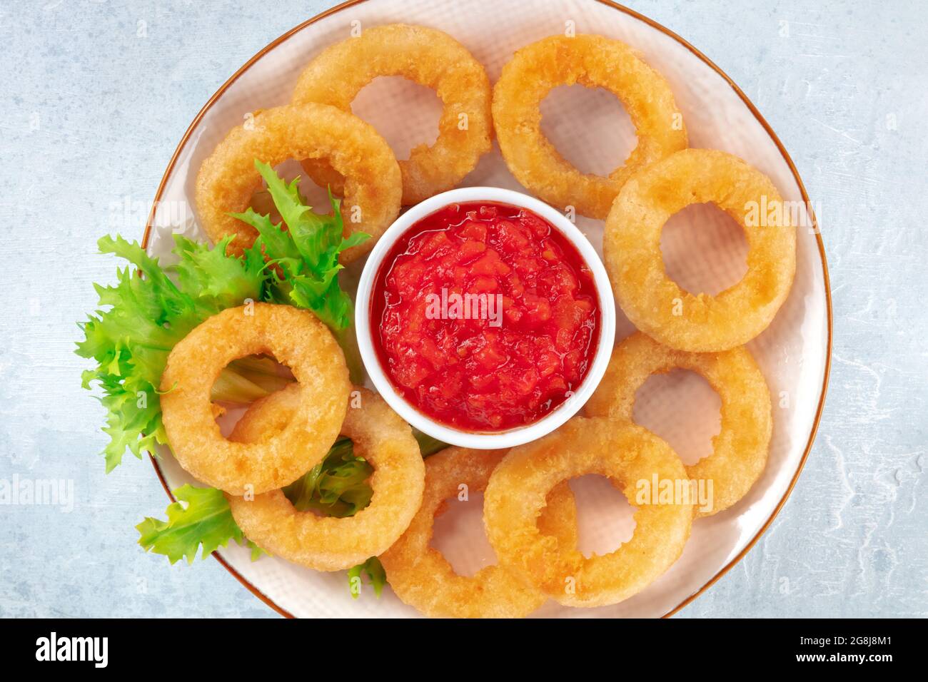 Calamari rings close-up. Deep fried squid rings on a plate, shot from ...