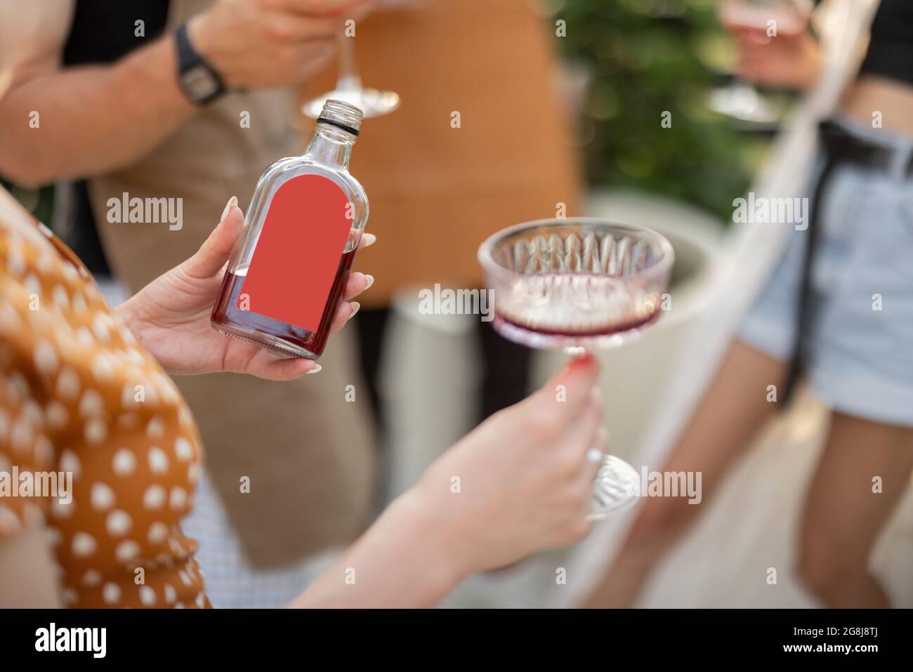People celebrating with alcohol outdoors Stock Photo - Alamy