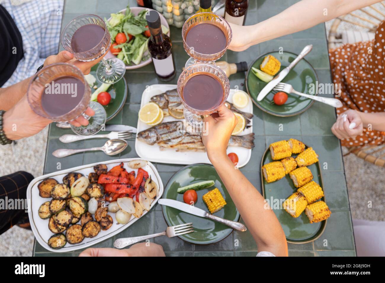 People eating and drinking at beautifully served table Stock Photo - Alamy