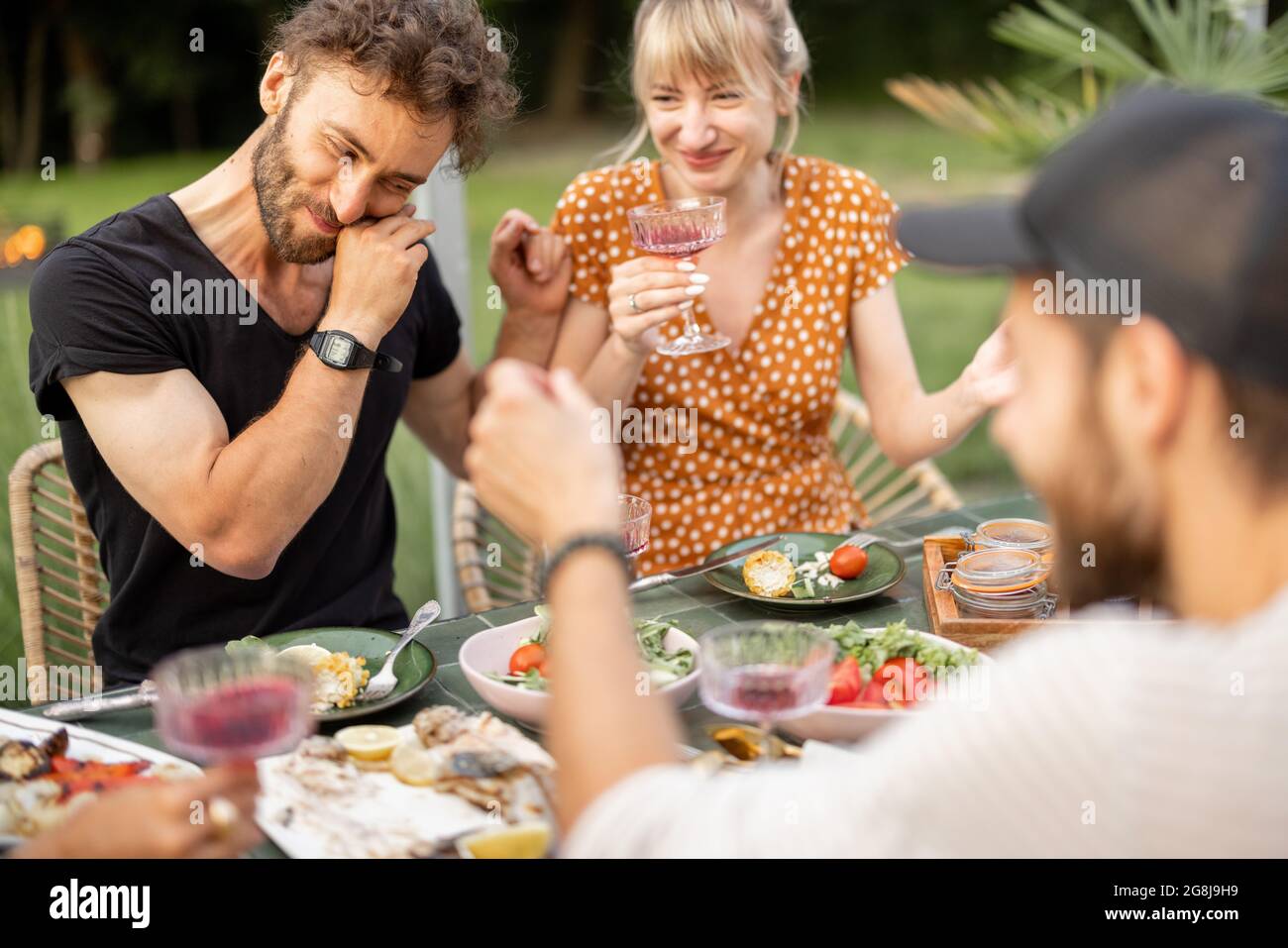 Pretty couple have fun at lunch outdoors Stock Photo - Alamy