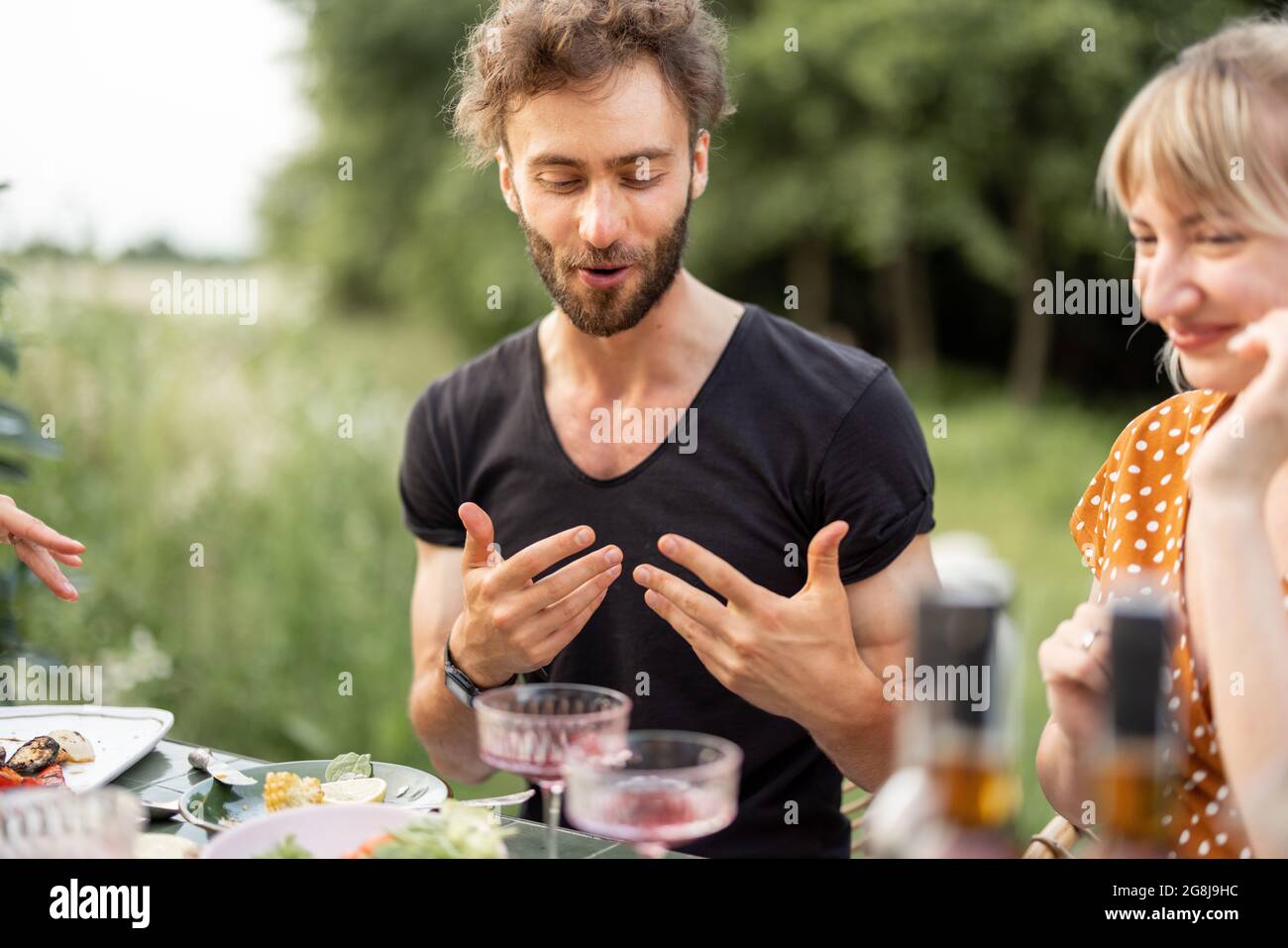Pretty couple have fun at lunch outdoors Stock Photo - Alamy