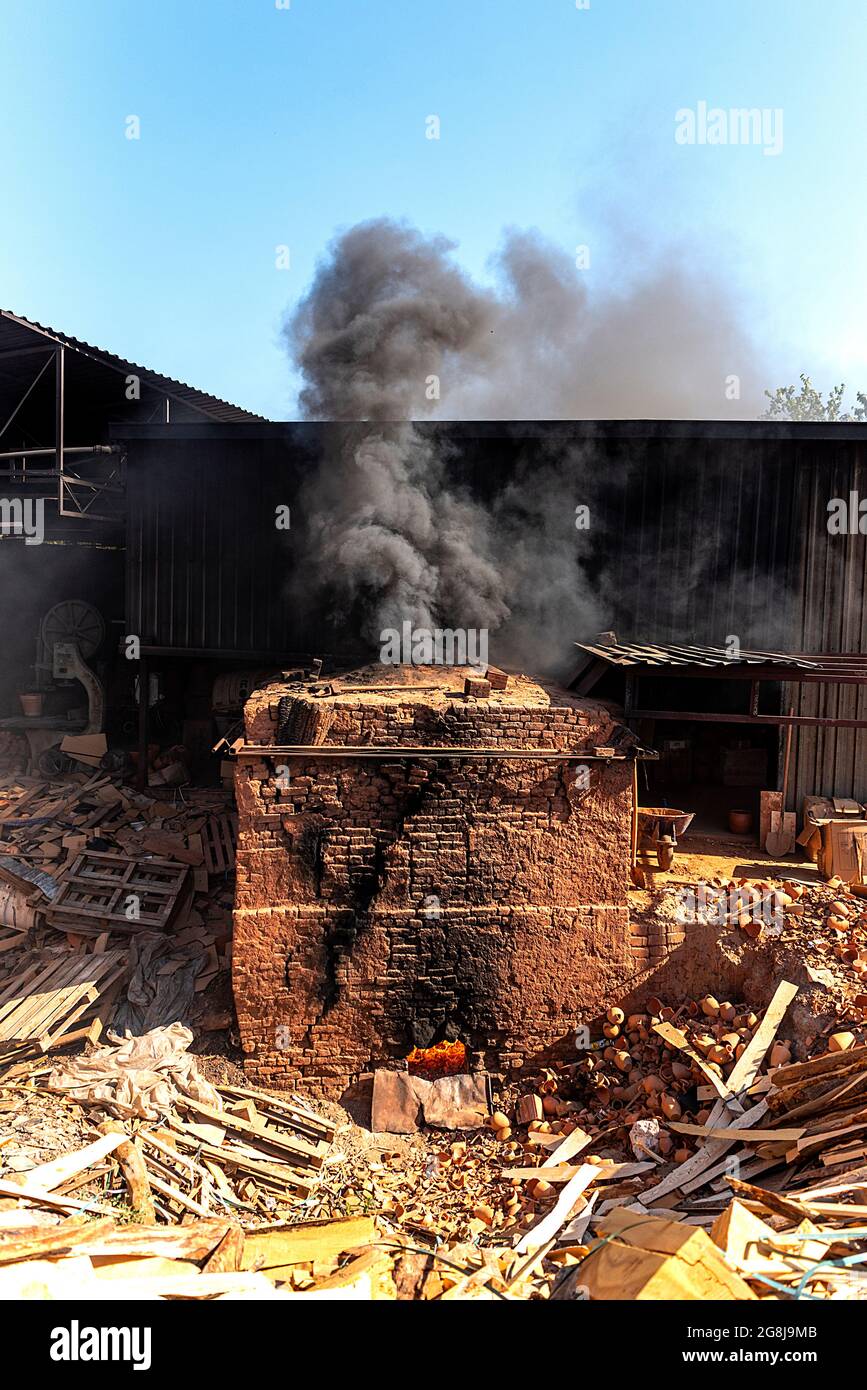pottery kiln made of brick burns with bad smoke Stock Photo - Alamy