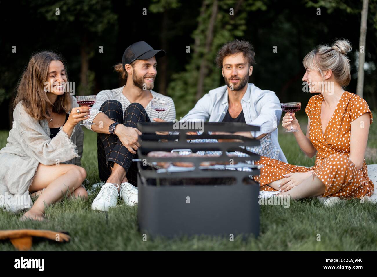 Young couples picnic bonfire hi-res stock photography and images - Alamy