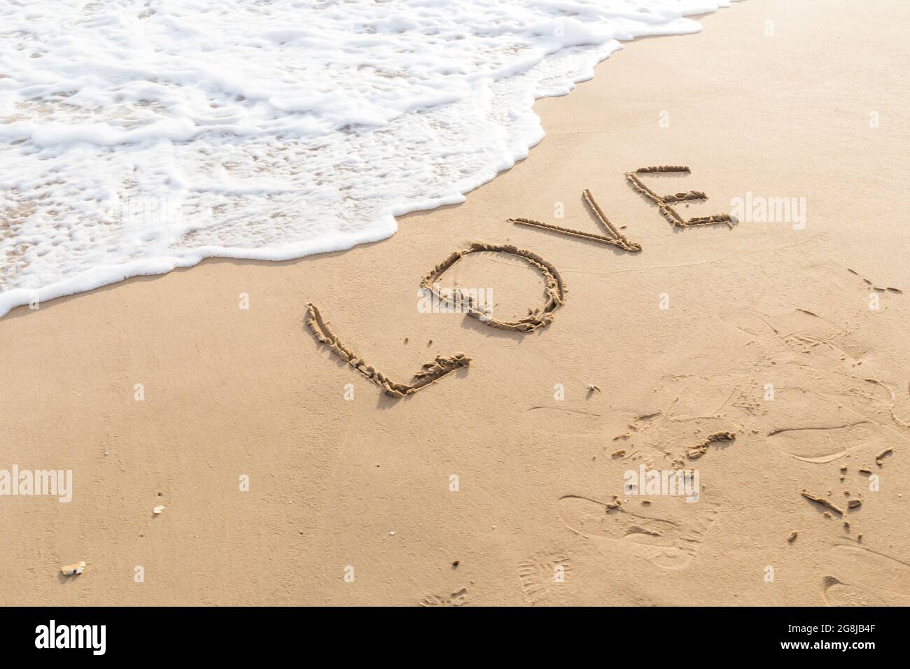 love message written in sand background Stock Photo - Alamy