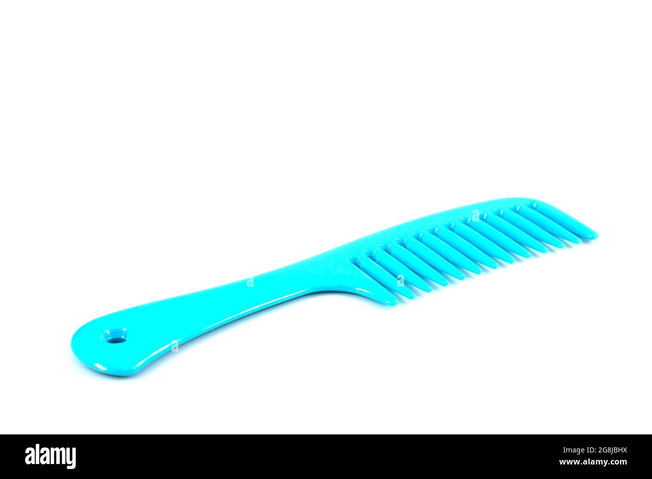 Blue comb isolated on white background Stock Photo - Alamy