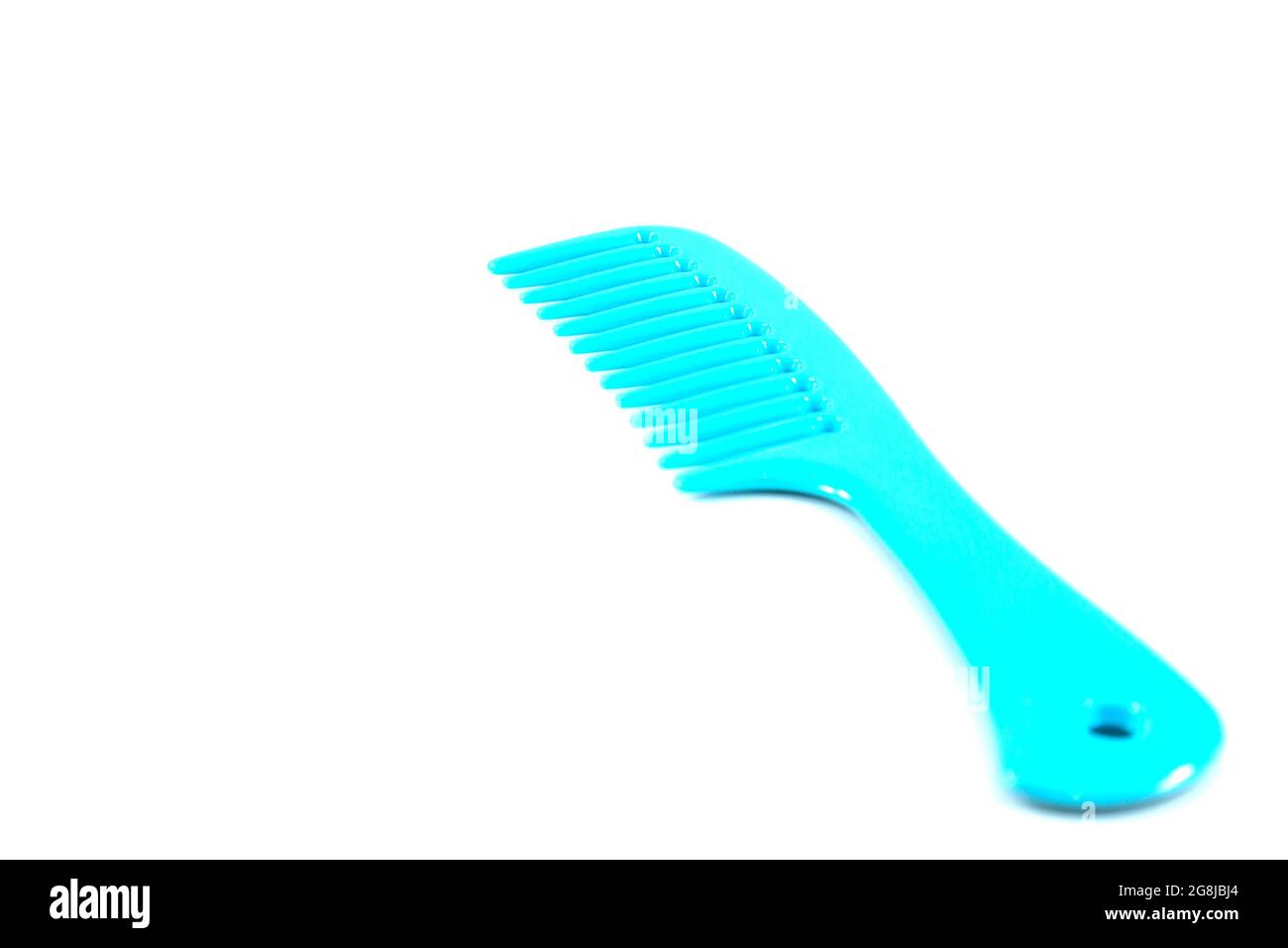 Blue comb isolated on white background Stock Photo - Alamy
