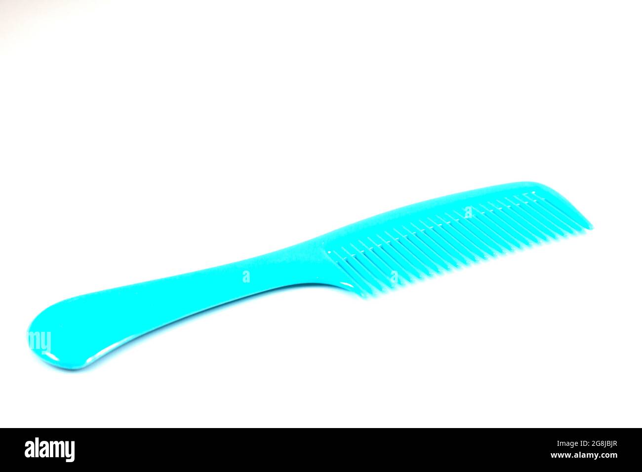 Blue comb isolated on white background Stock Photo - Alamy