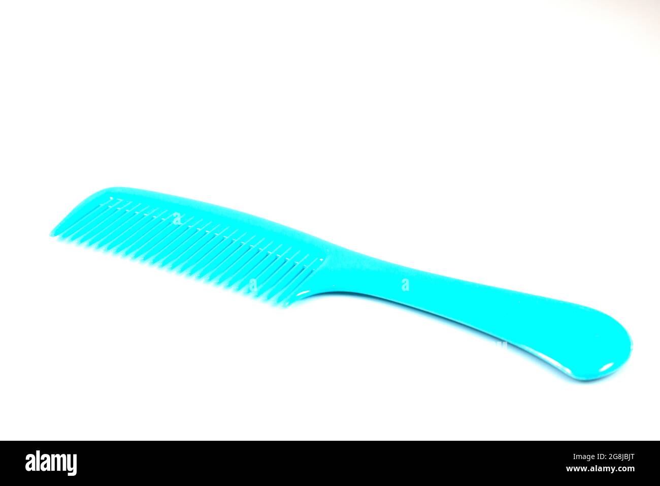 Blue comb isolated on white background Stock Photo - Alamy