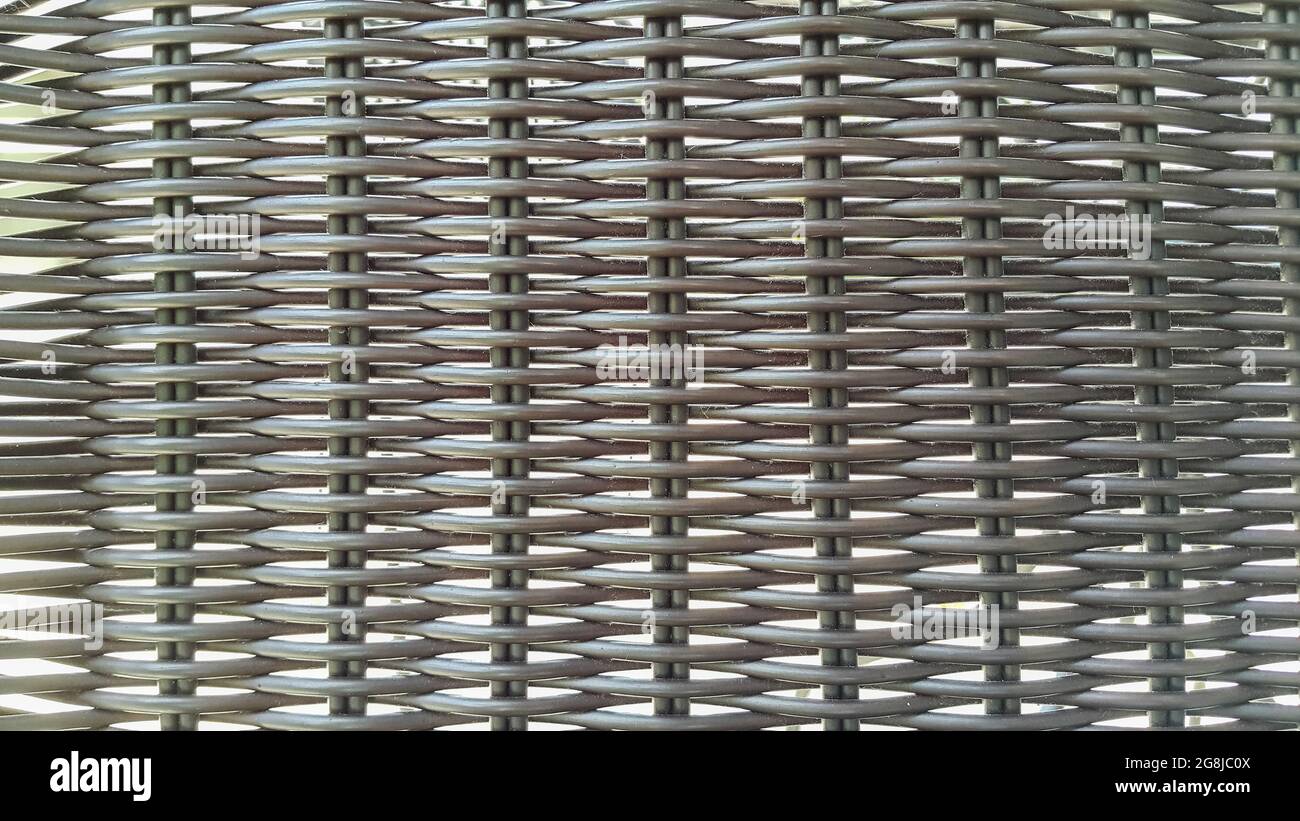 Black synthetic rattan texture weaving background Stock Photo - Alamy