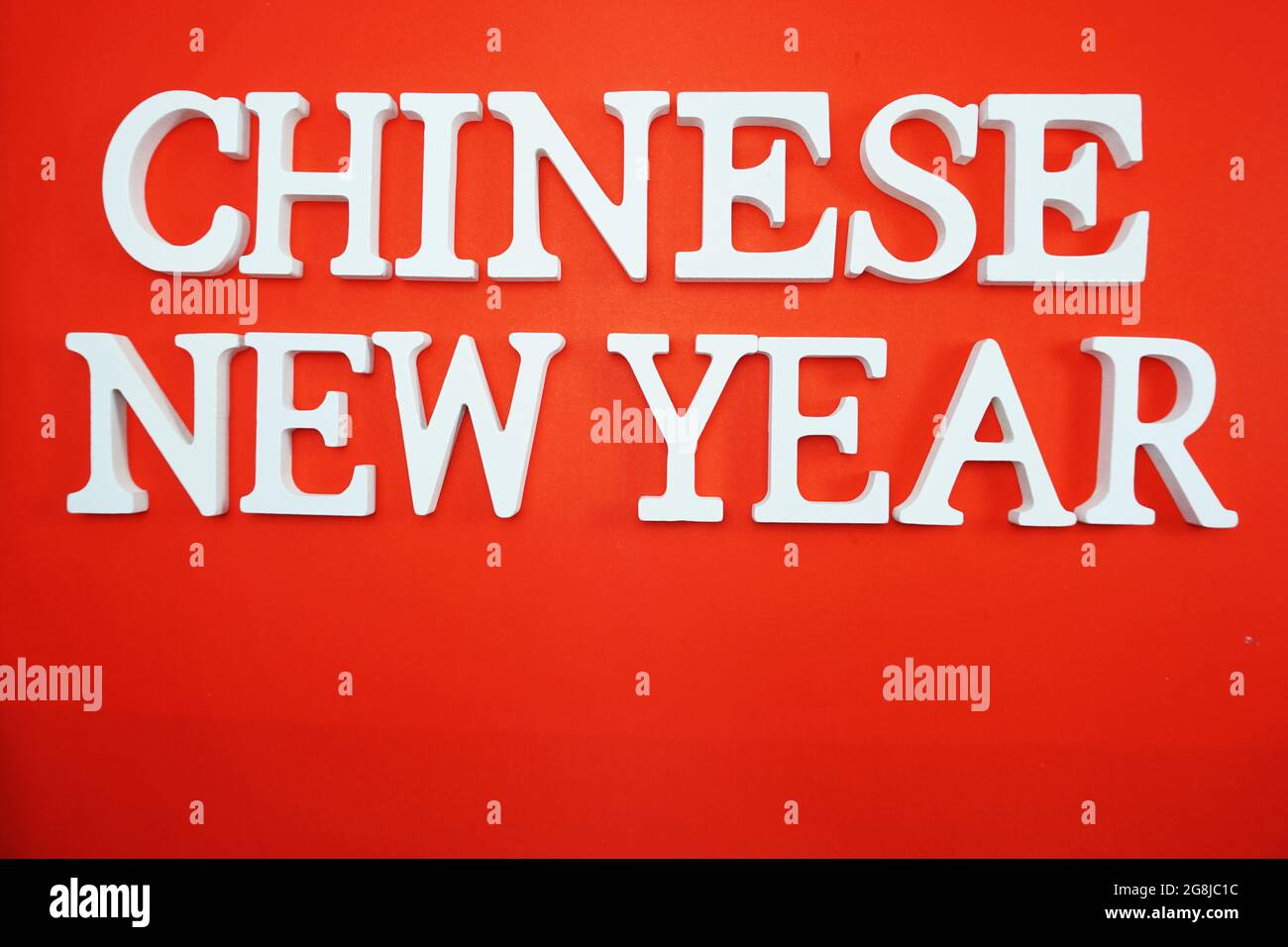 Chinese New Year alphabet letters top view on red background Stock ...