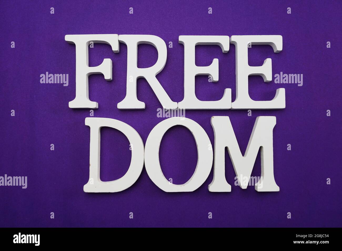 Freedom alphabet letters top view on green background Stock Photo - Alamy