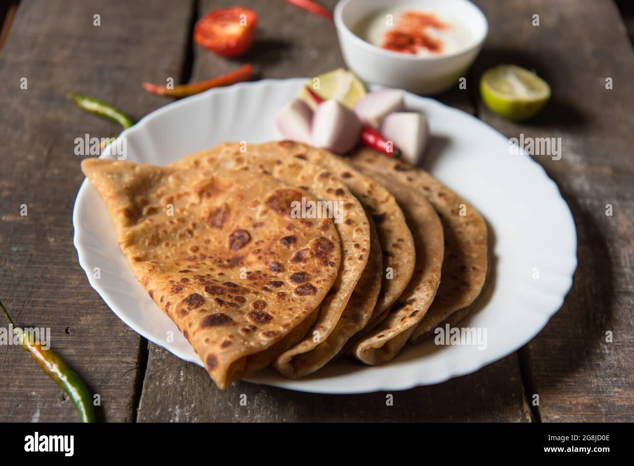 Stuffed sattu ka paratha or channa dal paratha served with condiments ...
