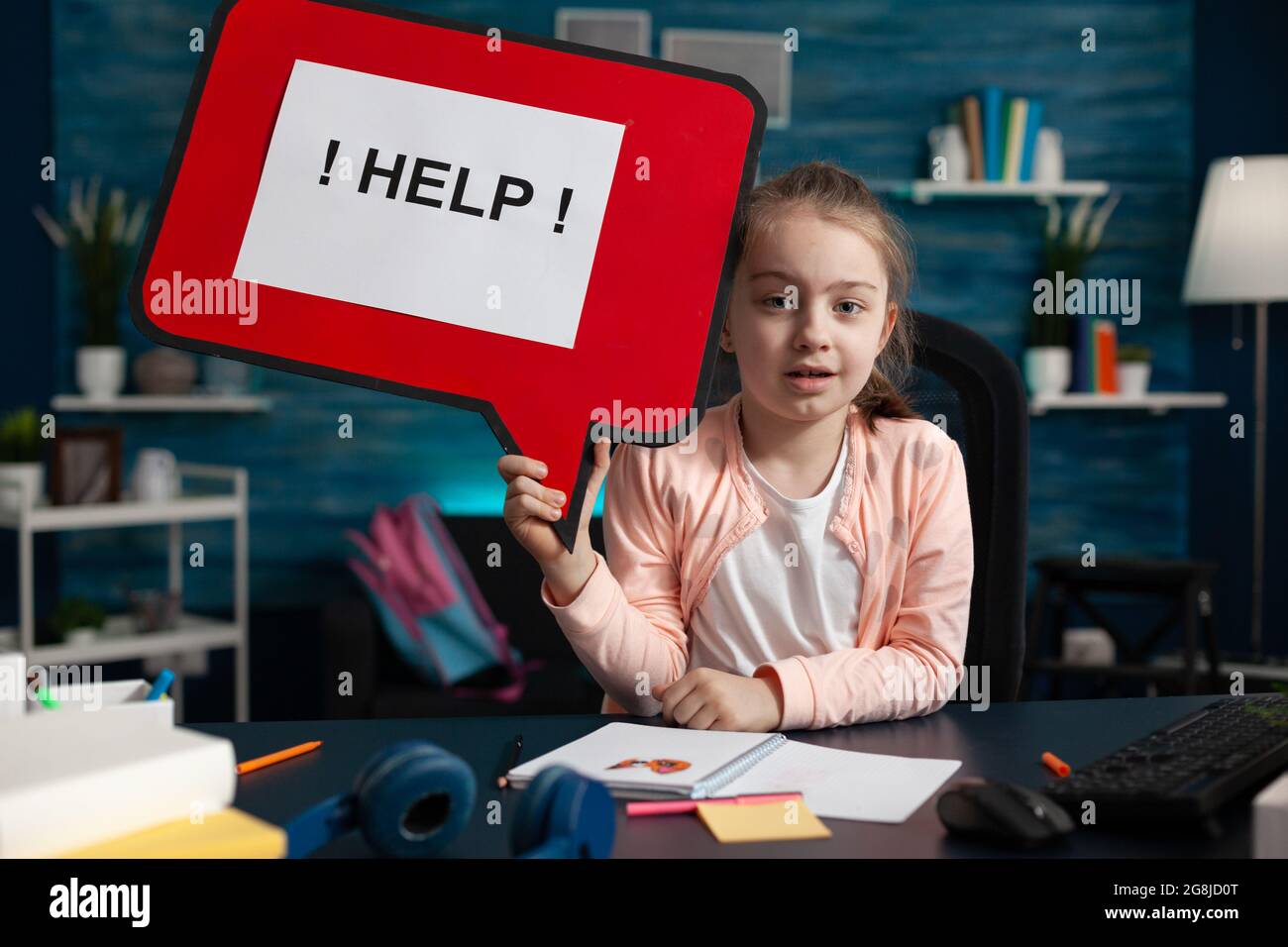 Conceptual image of little school girl needing help with homework ...