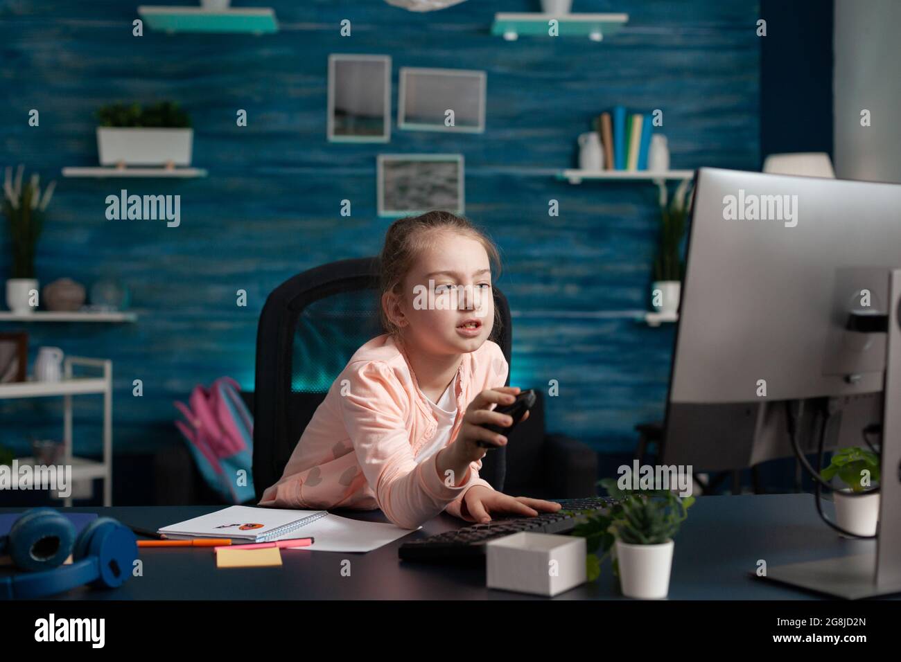 Tired elementary student joining online lesson from home feeling sad ...