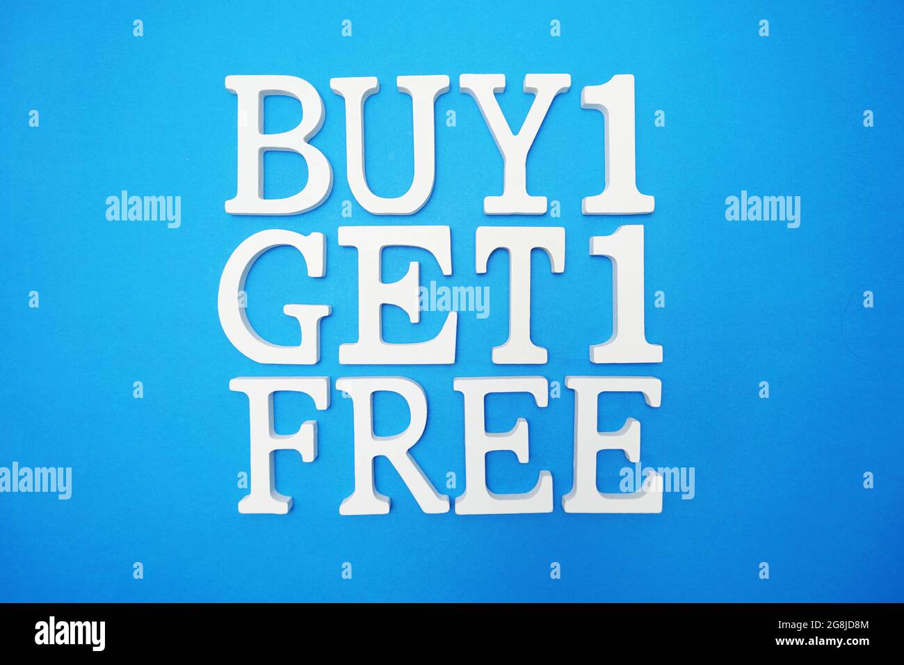 BUY 1 GET 1 FREE alphabet letters on blue background Stock Photo - Alamy