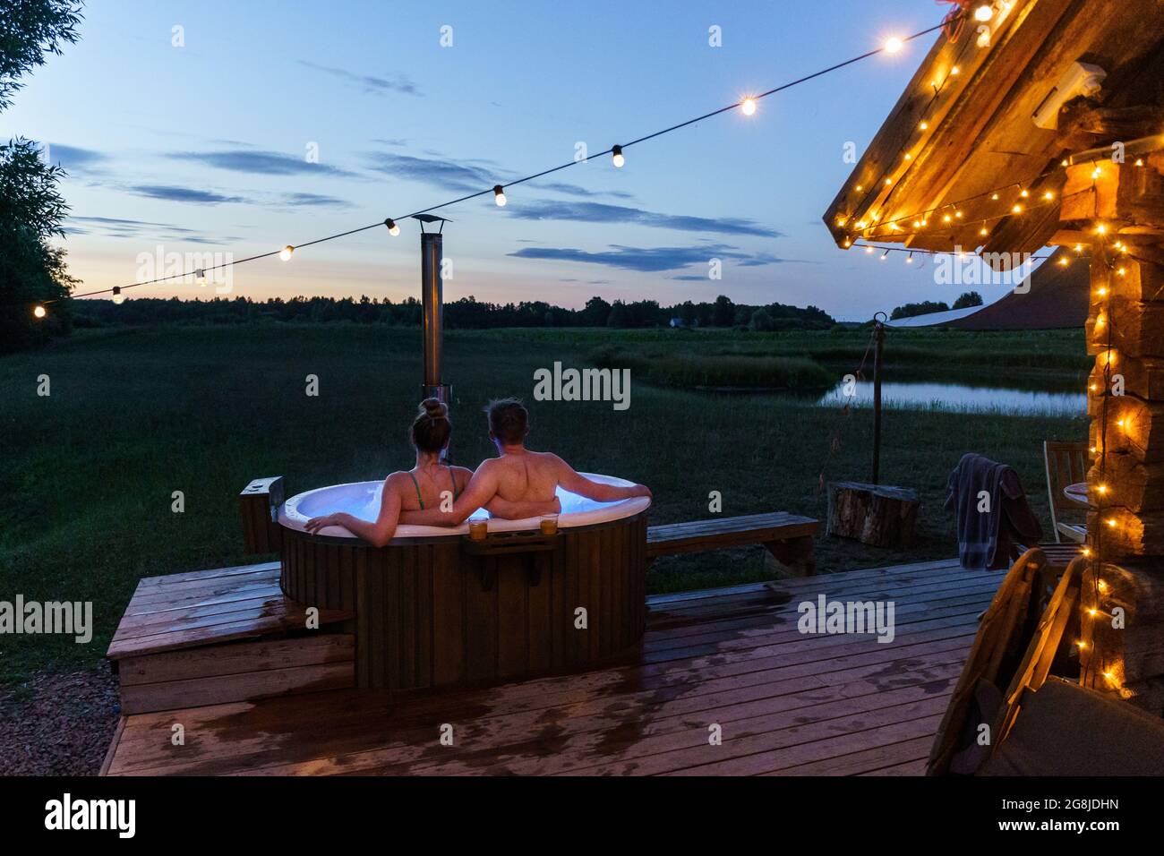 Wooden hot tub couple hi-res stock photography and images - Alamy