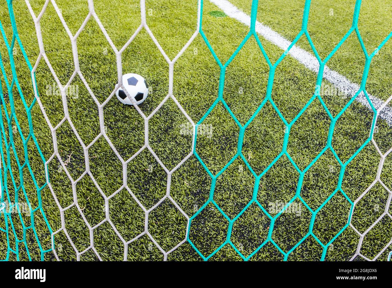 soccer ball in goal, football sport Stock Photo - Alamy