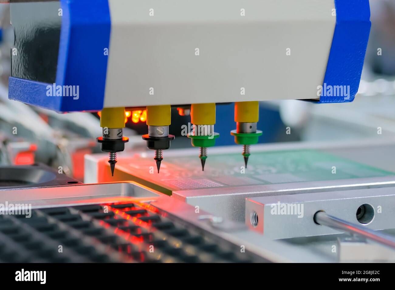 Automatic SMD pick and place machine assembling computer circuit board Stock Photo - Alamy