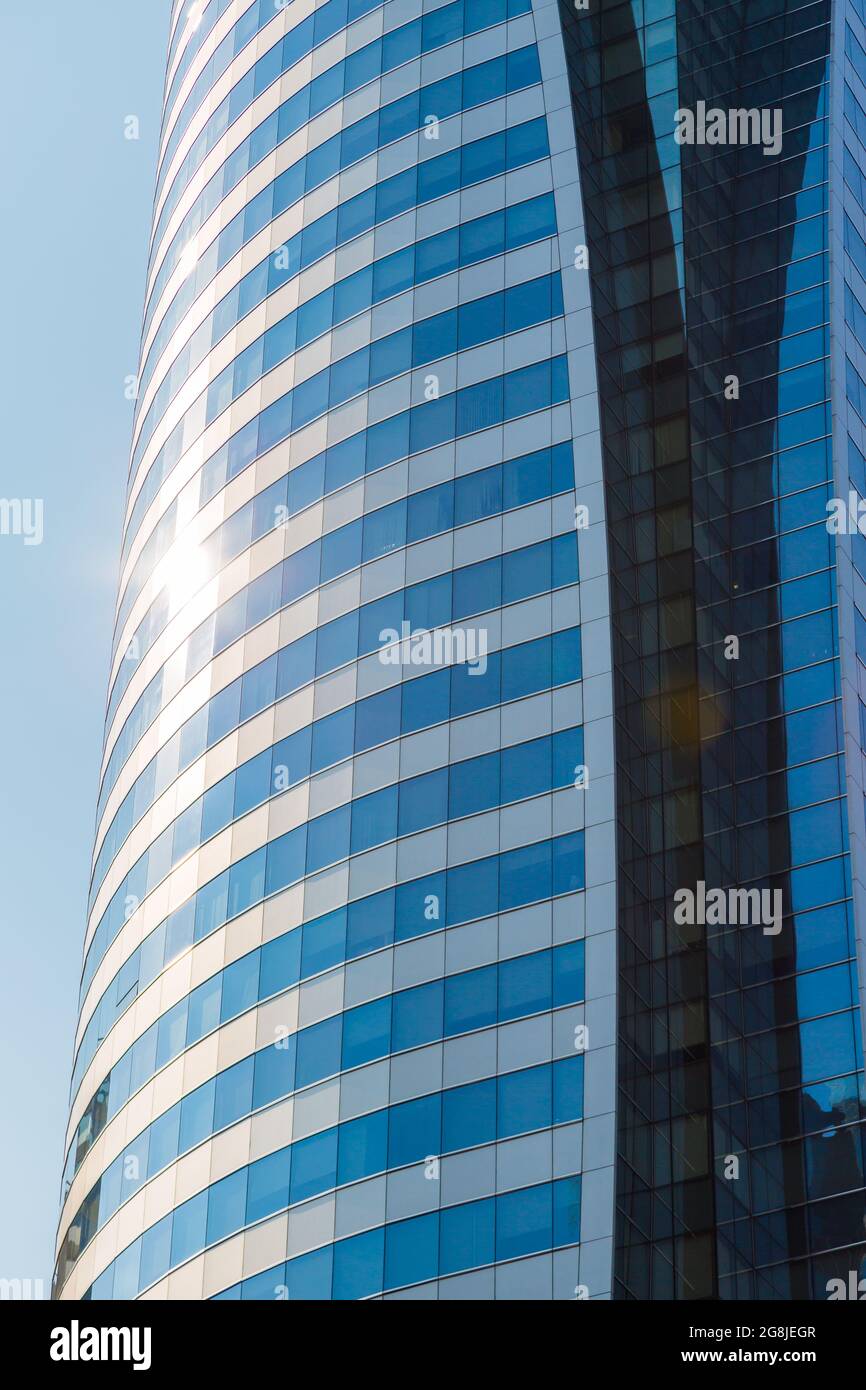 Modern glass building in the city with reflections Stock Photo - Alamy