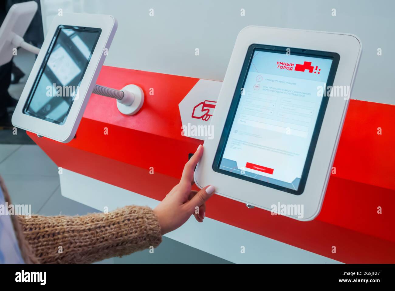 Close up view: vertical tablet kiosk at exhibition with registration ...