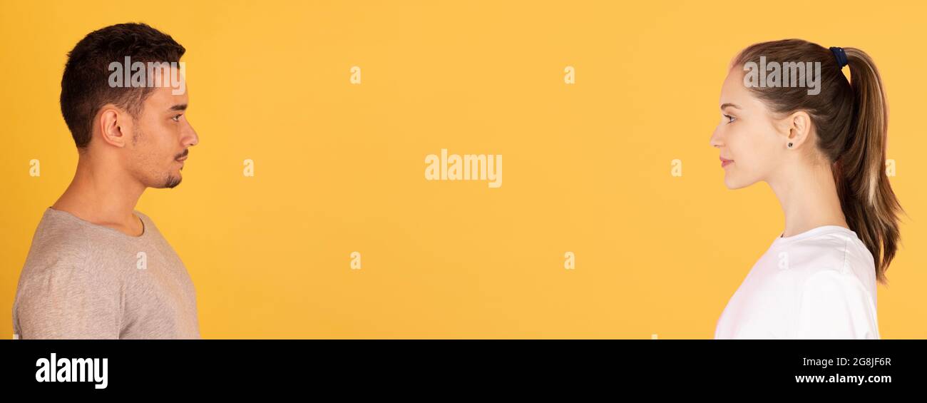 Portraits of two people, man and woman standing opposite each isolated ...