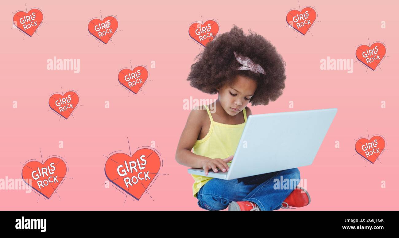 Composition of girl power text over girl using laptop Stock Photo - Alamy