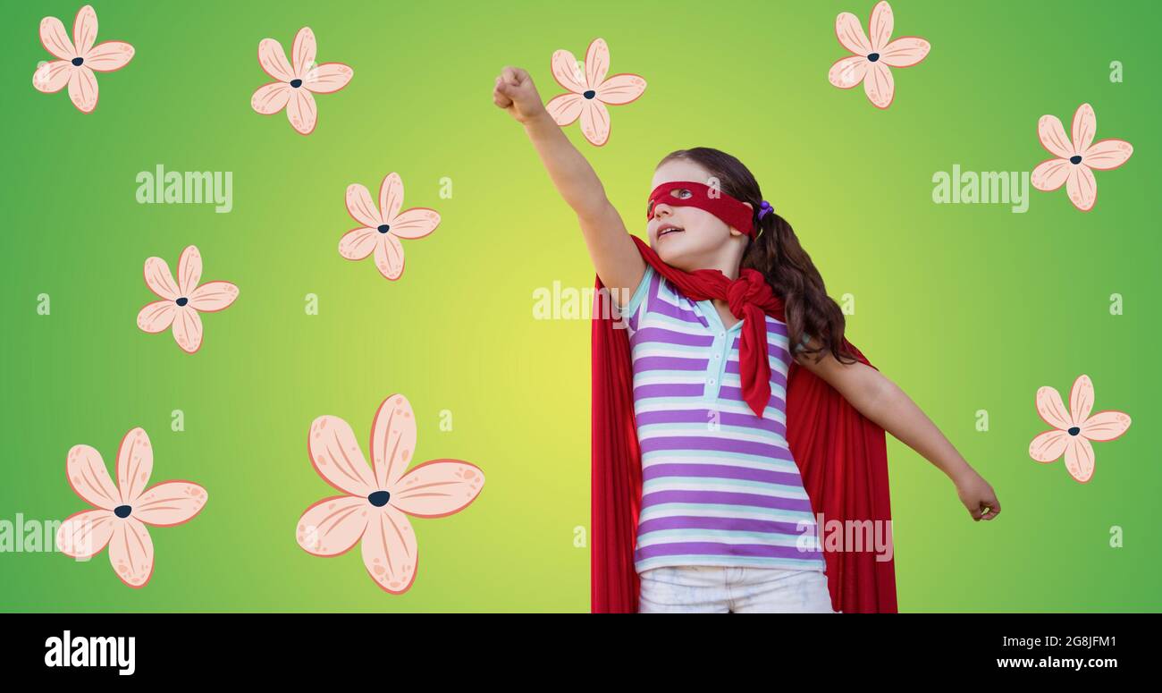 Composition of flowers over girl in superhero costume Stock Photo - Alamy