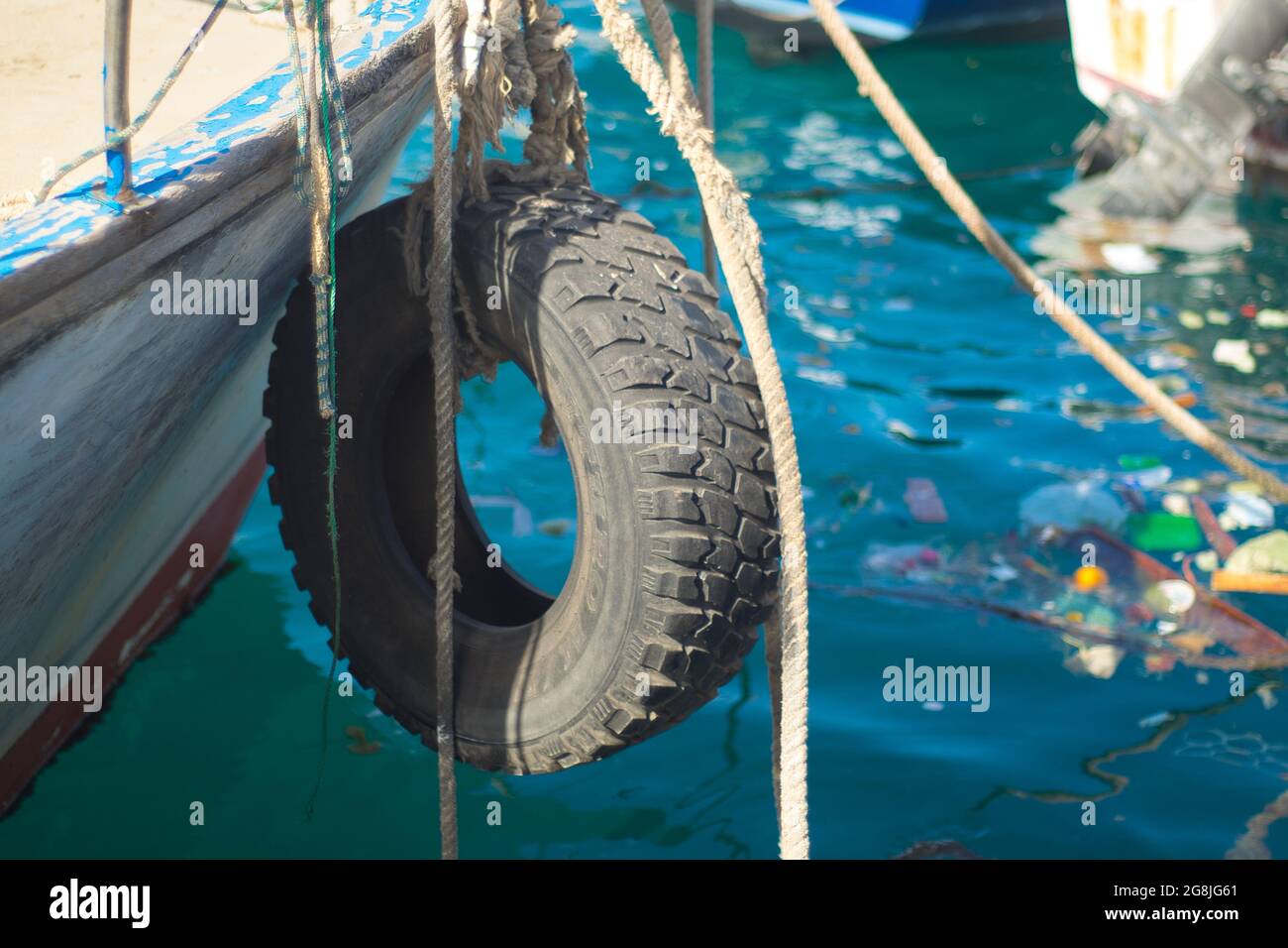 Tire hanging on boat hi-res stock photography and images - Alamy