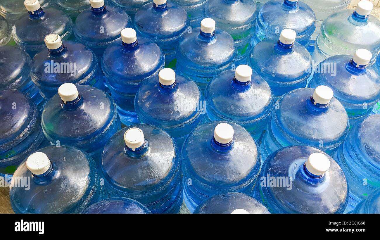 alot of water container on the floor Stock Photo - Alamy