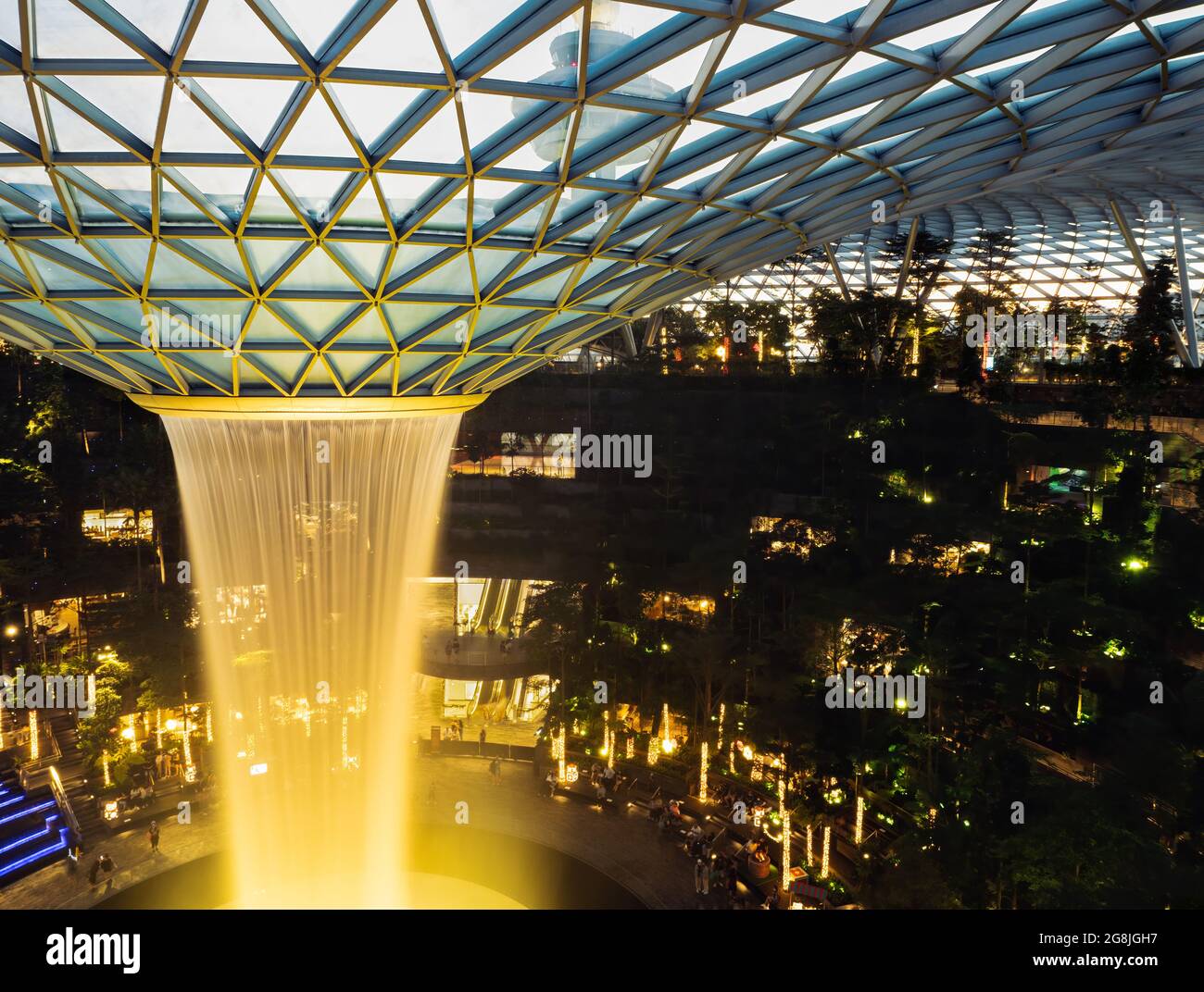 HSBC Rain Vortex at Changi Airport's Jewel light up in the evening ...