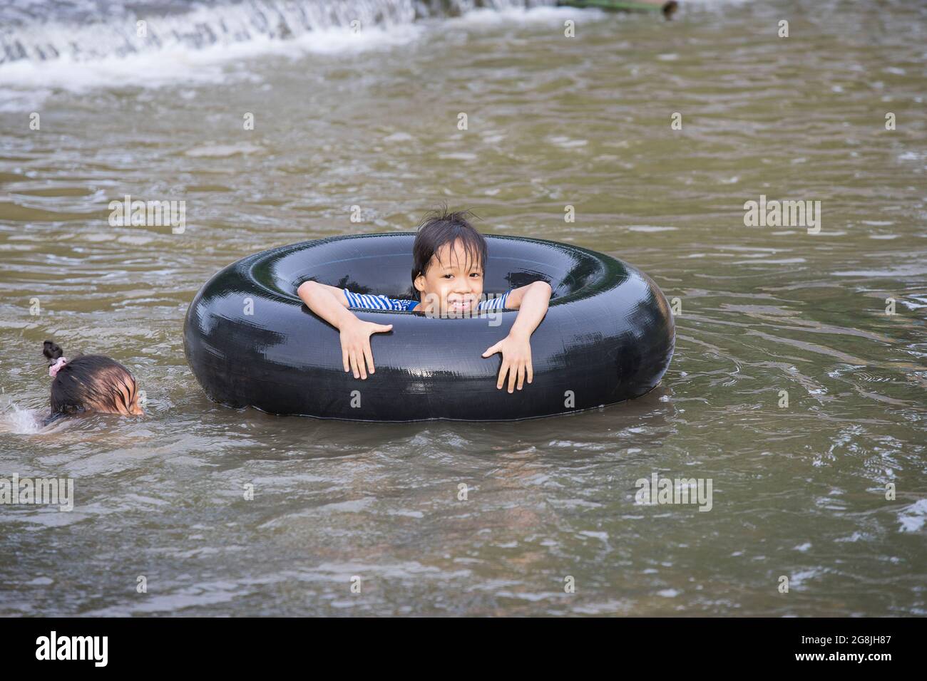 Boy tube water river hi-res stock photography and images - Alamy
