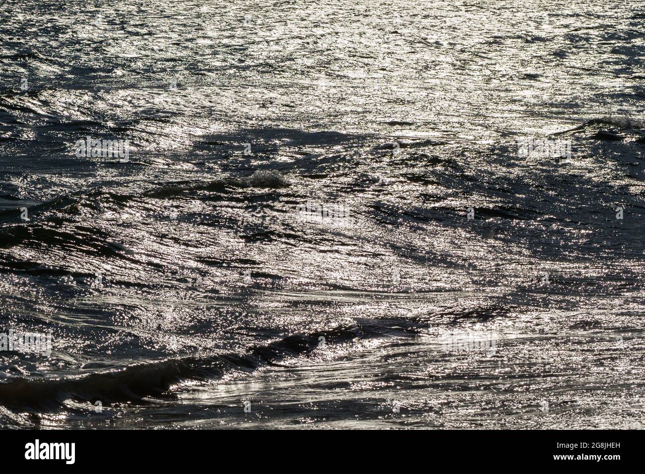 Water reflection from sun light at the beach Stock Photo - Alamy