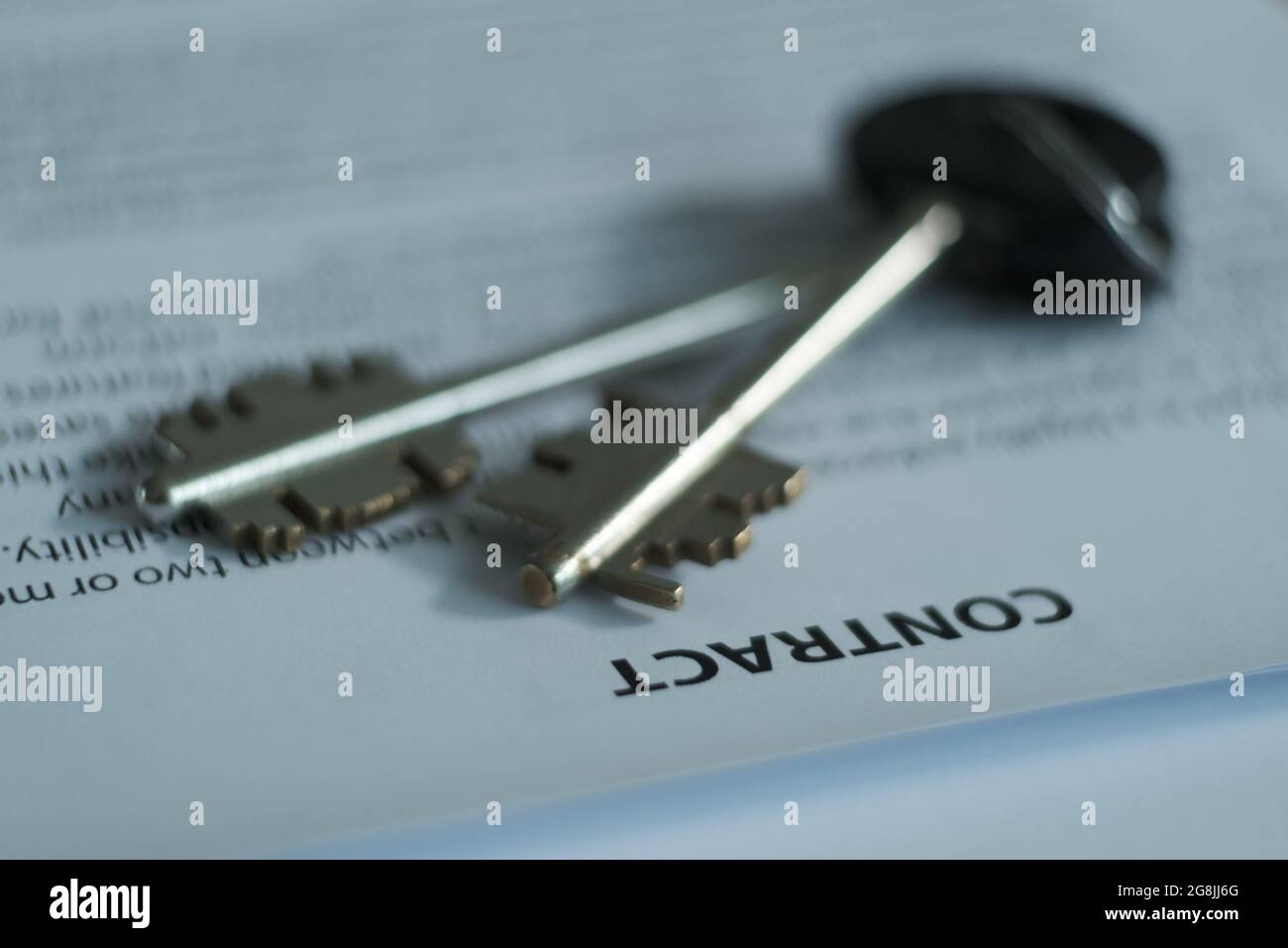 There is a contract and car keys on the table, the emphasis is on the ...