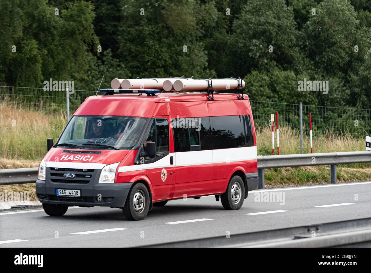 Passage of a column of fire brigade cars hi-res stock photography and ...