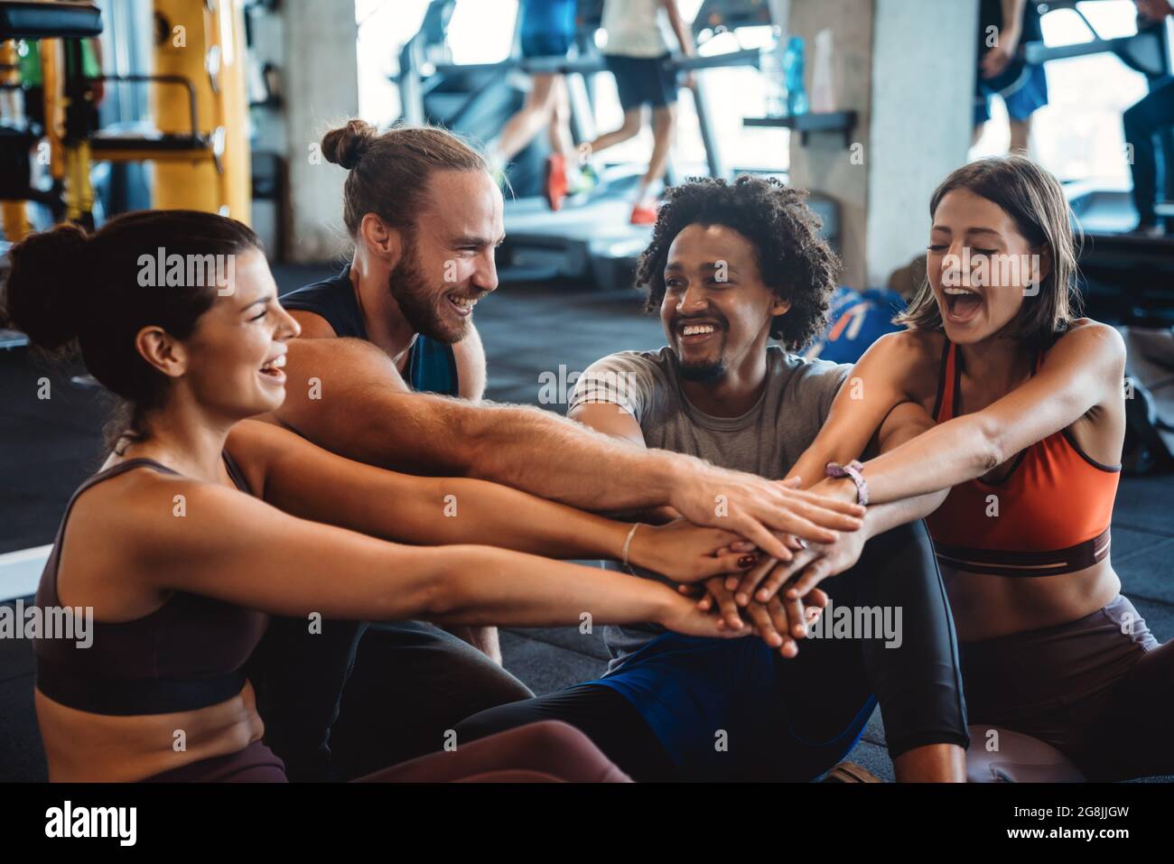 Group of happy people friends working out in gym together Stock Photo ...