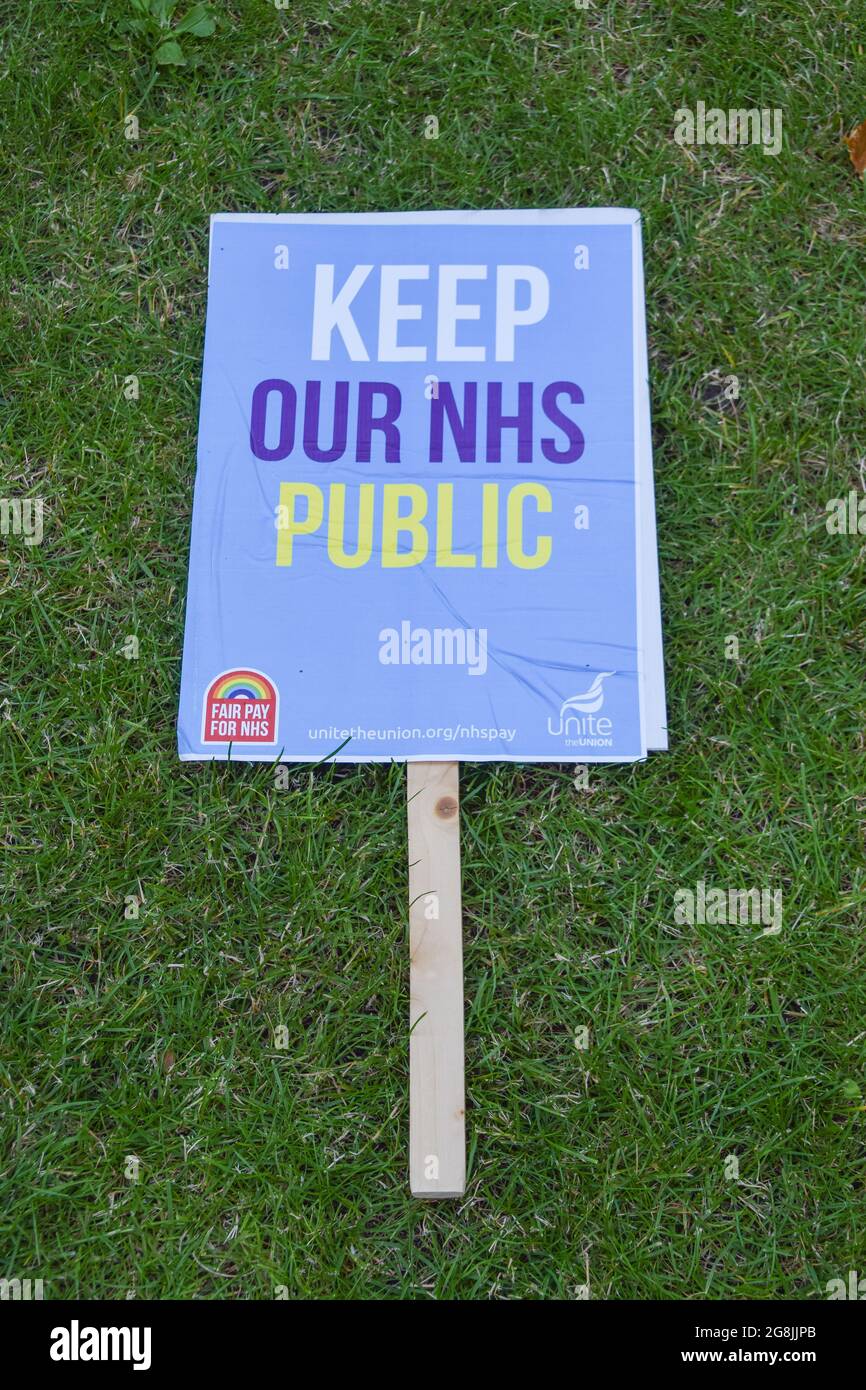 London, United Kingdom. 20th July 2021. 'Keep Our NHS Public' placard ...