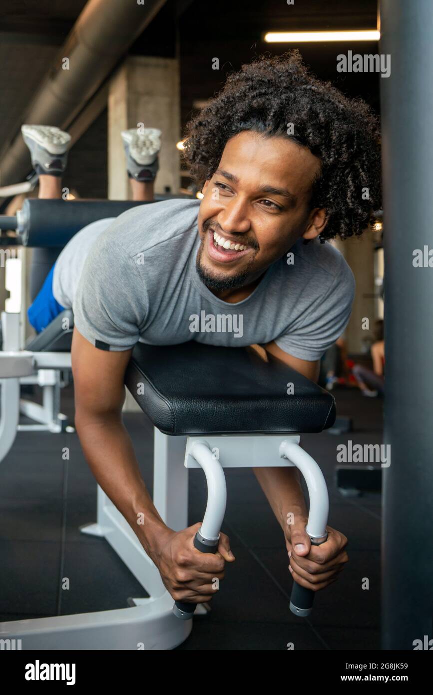 Confident fit young man exercising at fitness center Stock Photo - Alamy