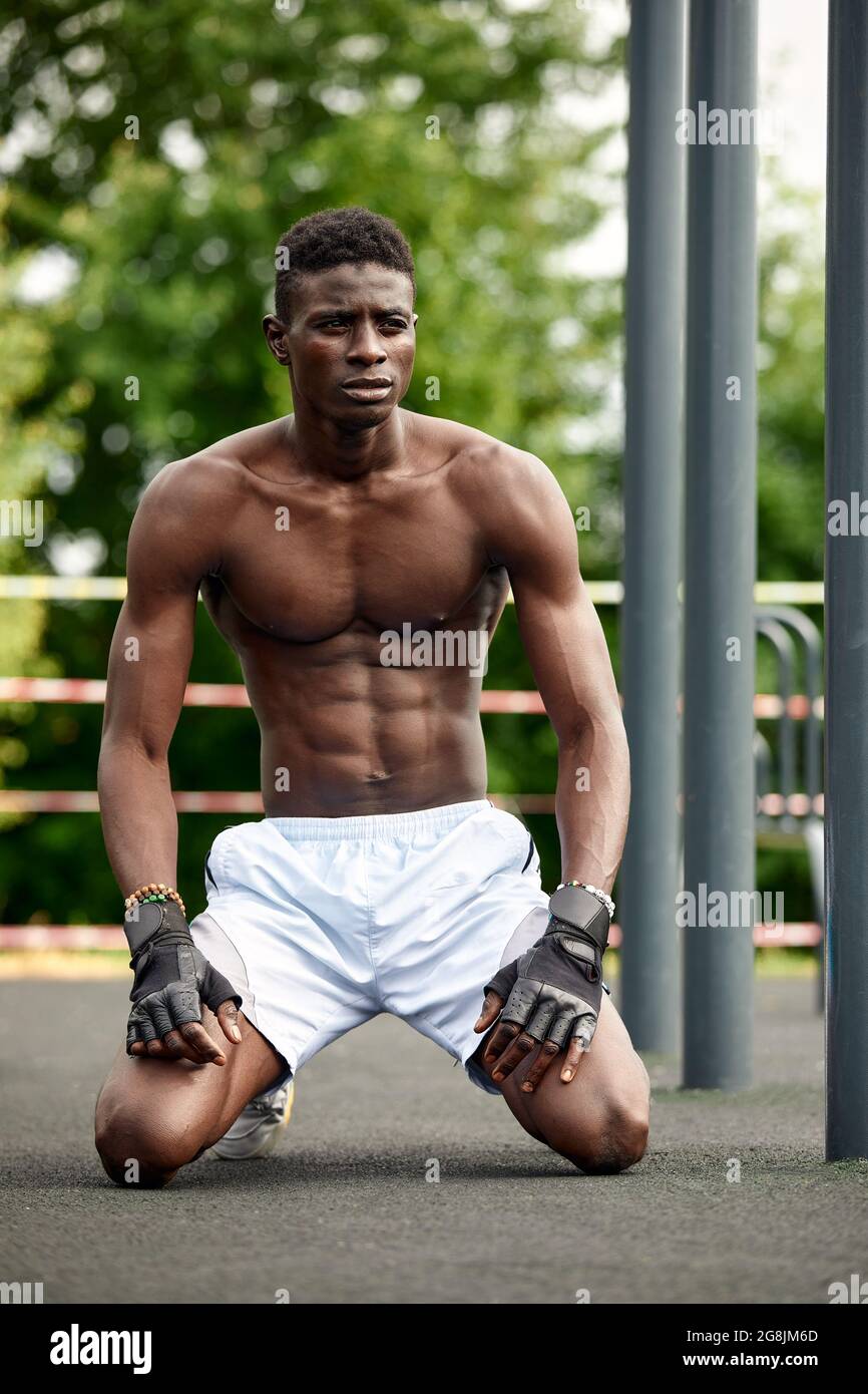 Athlete resting between outdoor exercises, outdoor exercise, African ...