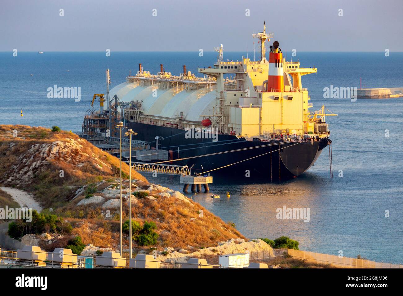 Huge tanker gas carrier at the berth of a power station on the island ...
