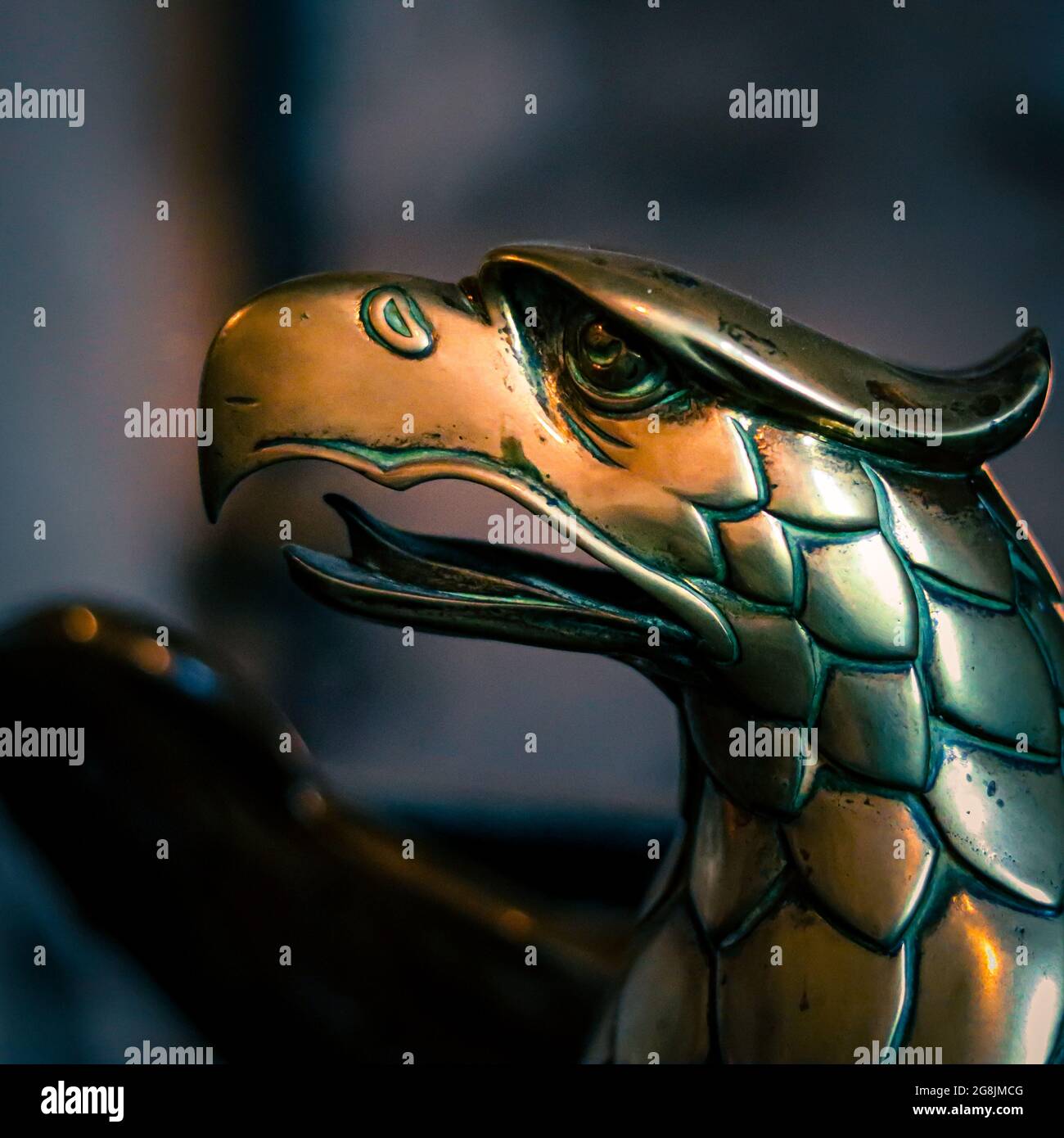 Selective focus shot of a golden sculpture of a mythical phoenix Stock ...