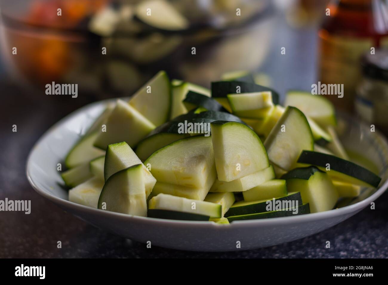 fresh cut vegetables in a plate while cooking healthy food Stock Photo ...