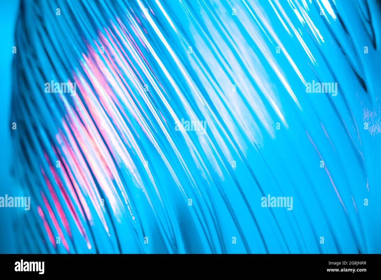 Abstract glass background. Texture of wavy glass illuminated with multi ...