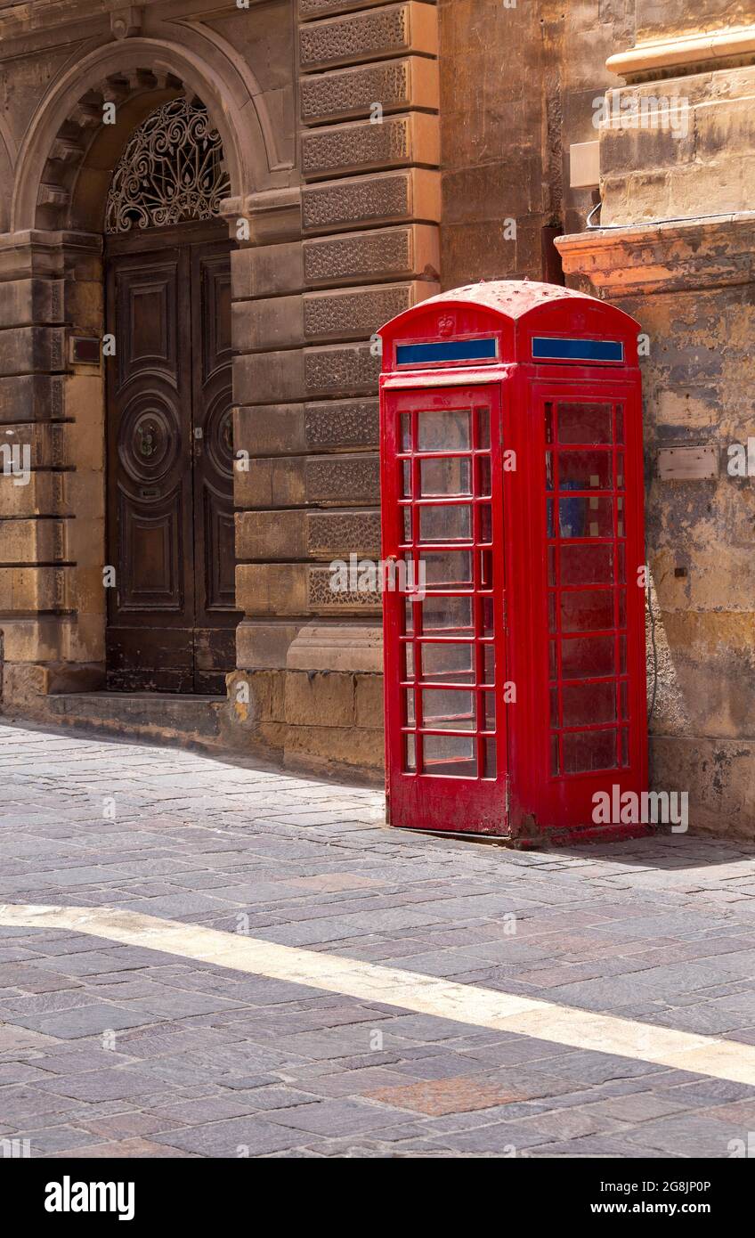 Old wooden red english telephone box in Valletta. Malta Stock Photo - Alamy