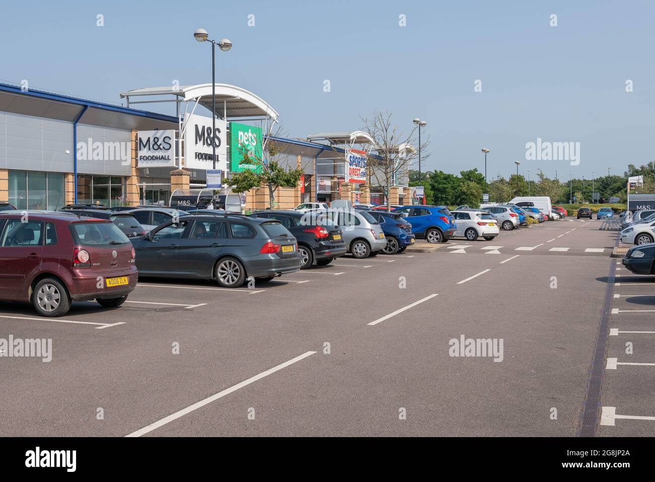 A view of Longwater retail car park with cars parked in allocated ...