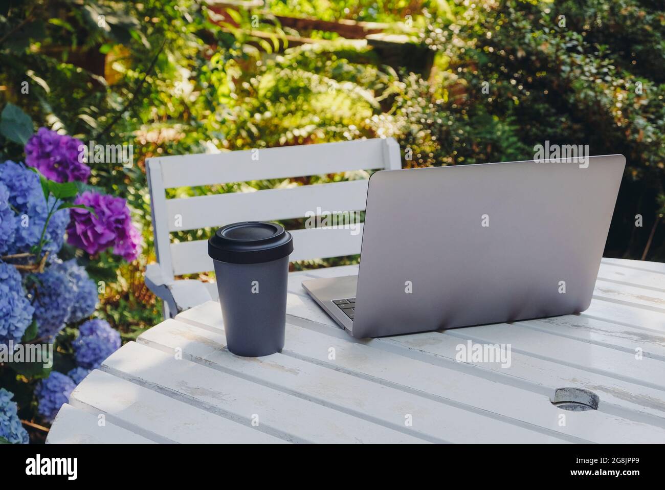 Working from the garden concept. Remote work Stock Photo - Alamy