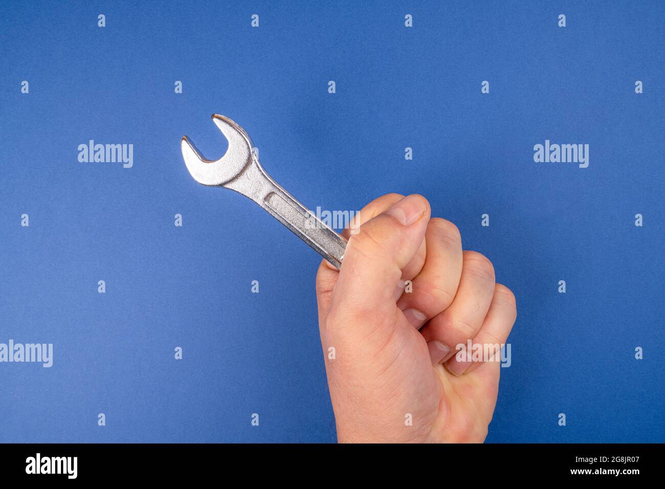 Man hand holding wrench hi-res stock photography and images - Alamy