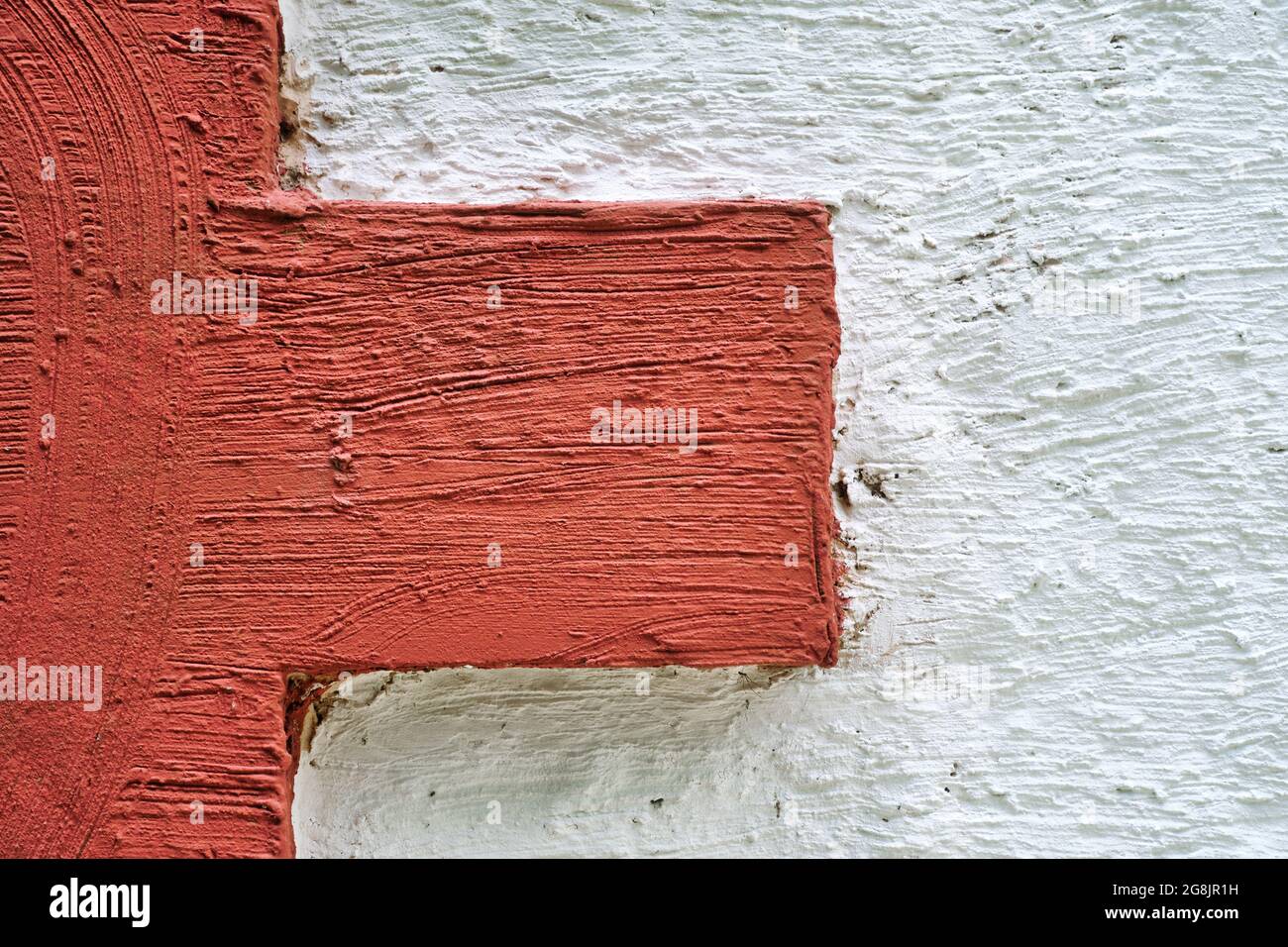 White plastered stone wall with red stucco quoin. Exterior wall design ...