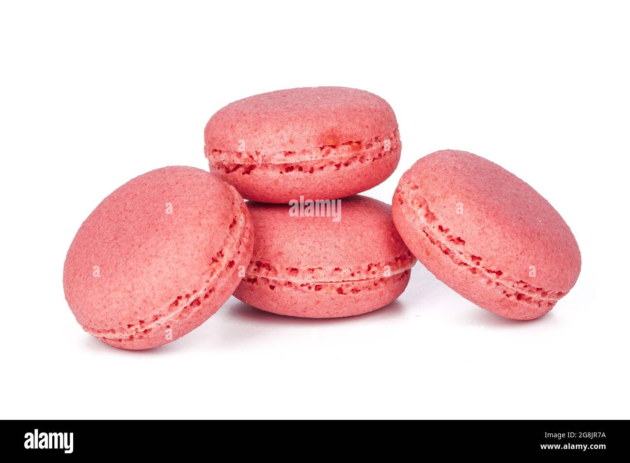 Delicious four pink macarons or macaroons isolated on a white ...